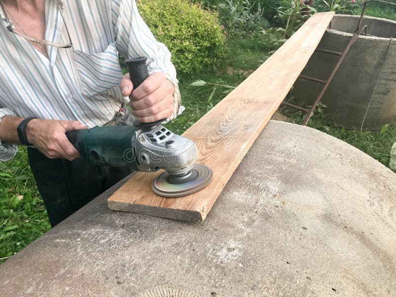The Man Works with His Hands, Grinds the Disk Around for the Grinder ...