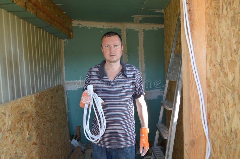 A Man Works in the Interior of the Repair and Construction Stock Image ...