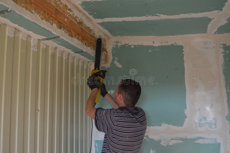 A Man Works in the Interior of the Repair and Construction Stock Image ...