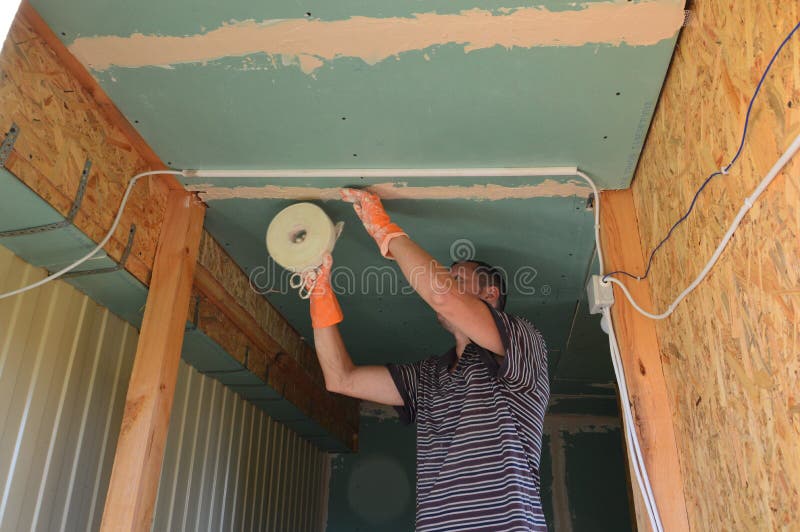 A Man Works in the Interior of the Repair and Construction Stock Image ...