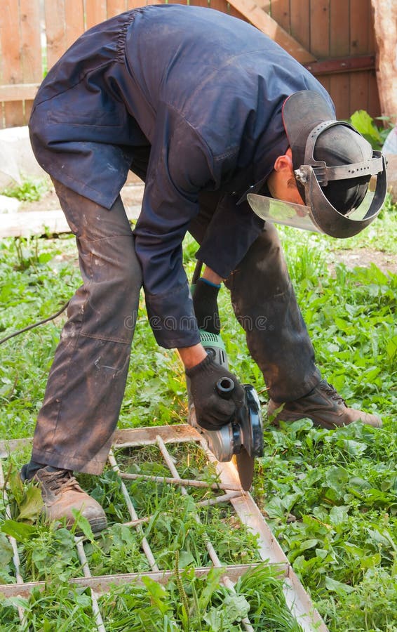 Man Works Outside, Cuts a Metal Stock Photo - Image of street, cutting ...