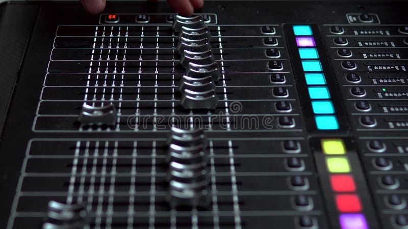 Man Works on a Professional Electronic Audio Mixer. a Control Panel for ...