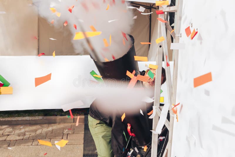 A Man Works on a Setup To Run Confetti Stock Photo - Image of place ...