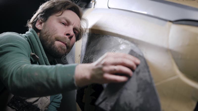 The Man Works in a Tuning Studio. Car Tuning. the Building of the Car S ...