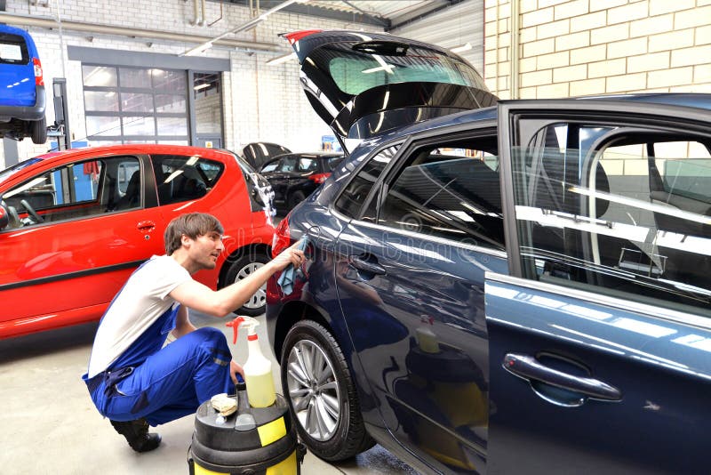 Man in a Workshop Cleaning a Car - Service for the Customer Stock Photo ...