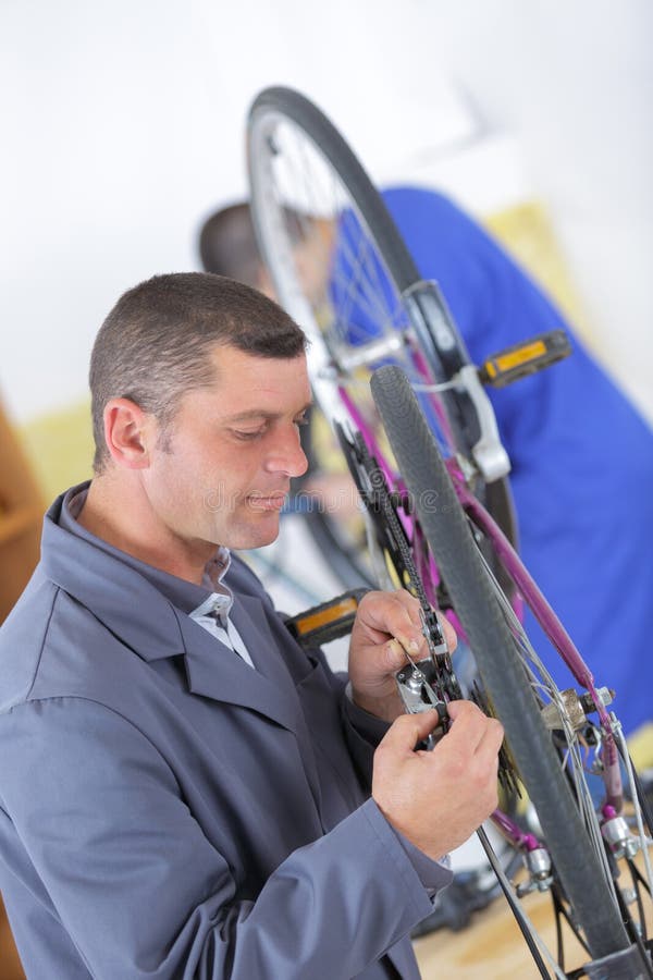 Man in Workshop Fixing Bike Frame Stock Photo - Image of working ...