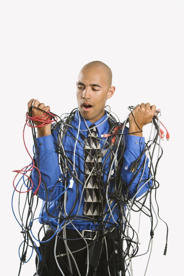 Man wrapped in cables. stock image. Image of african, confused - 2431811
