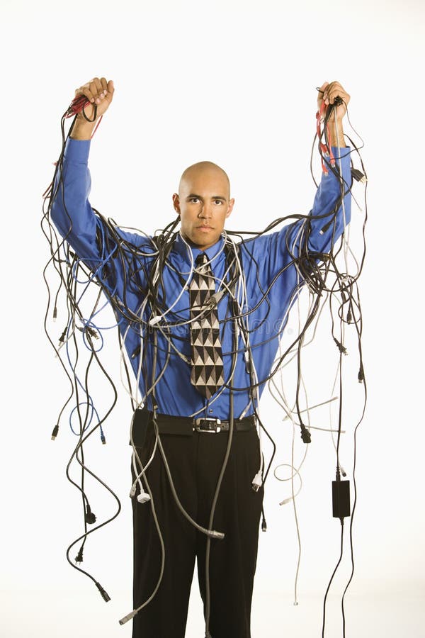 Man wrapped in cables. stock photo. Image of 070212a0157 - 2425866