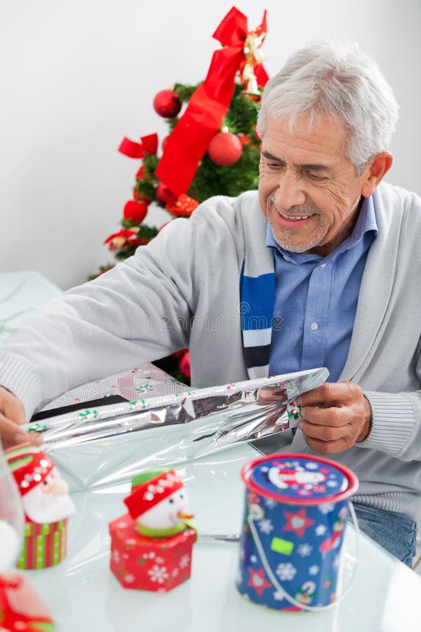 Man Wrapping Christmas Present Stock Photo - Image of present, packing ...