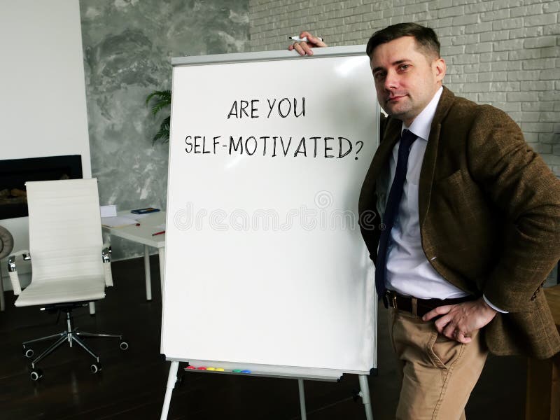 A Man Writes an Inscription are You Self Motivated? Work Motivation ...