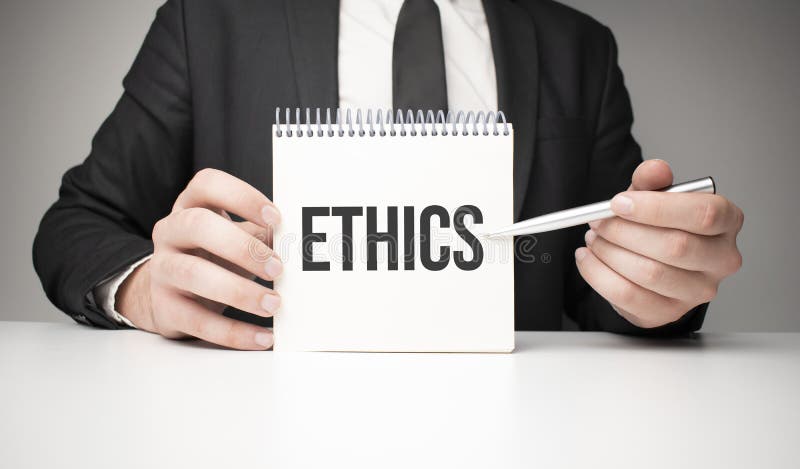 Man Writes in a Notebook with a Silver Pen and Hand Holding Card with ...