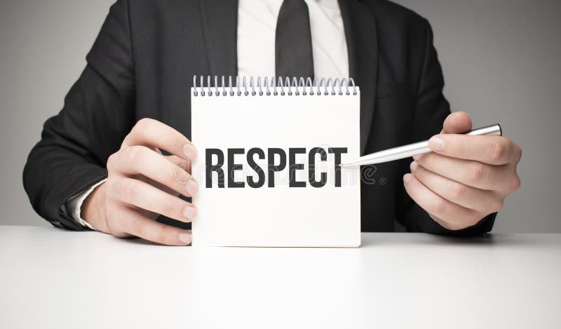 Man Writes in a Notebook with a Silver Pen and Hand Holding Card with ...