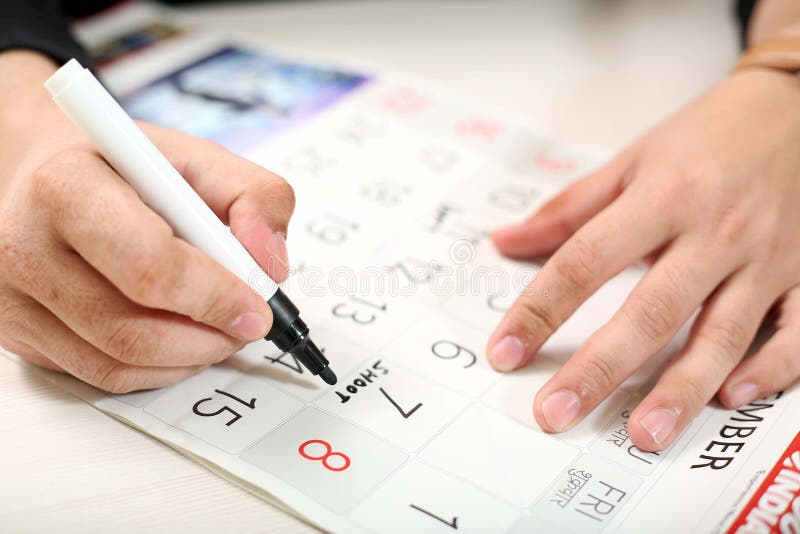 Man is Writing on Calendar with Marker Stock Image - Image of date ...