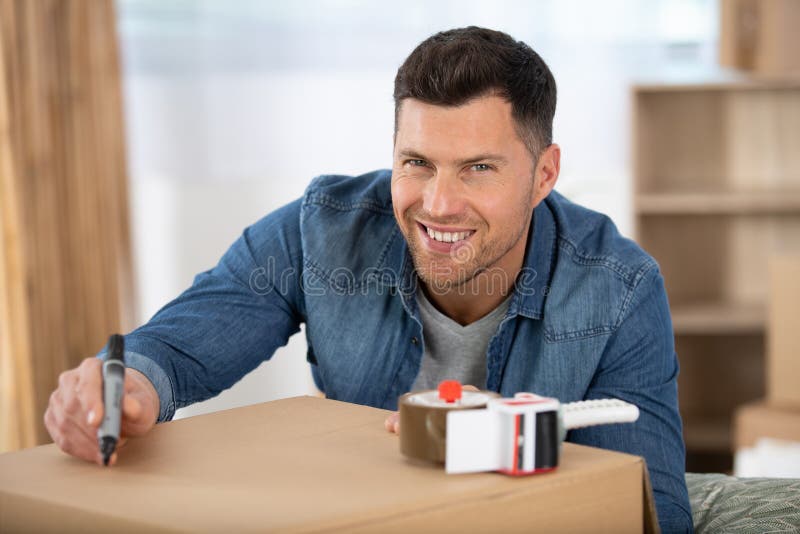 Man Writing on Cardboard Box Stock Photo - Image of transport, deliver ...
