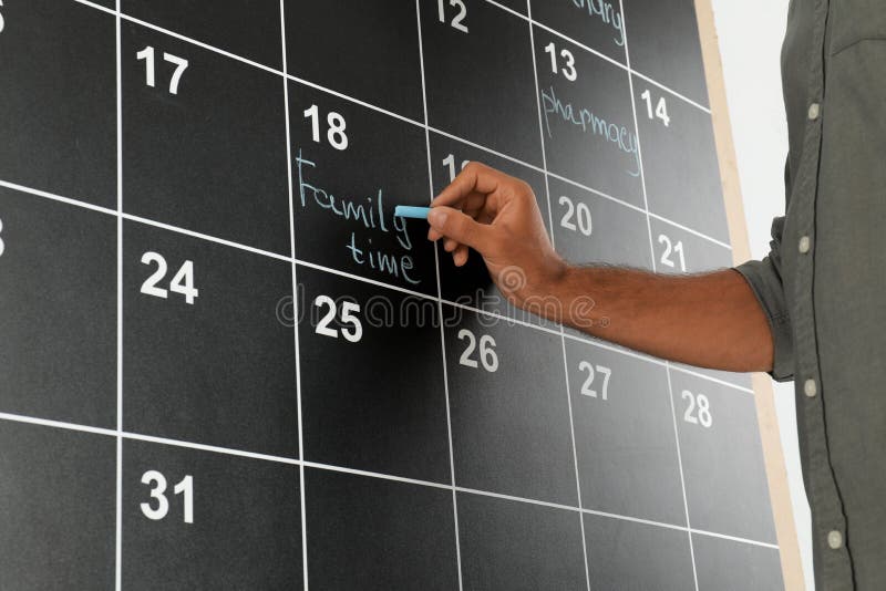 Man Writing with Chalk on Board Calendar, Closeup Stock Image - Image ...