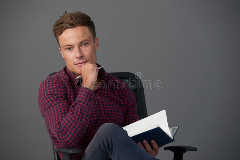 Man writing in diary stock image. Image of young, confident - 124920841