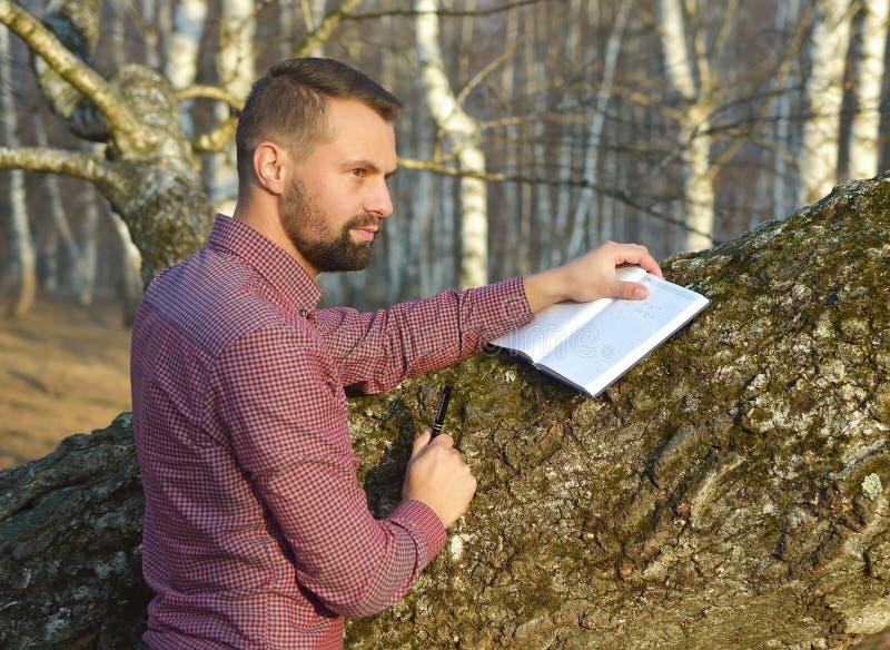 Man Writing in His Notebook Stock Image - Image of poet, poetess: 63321569