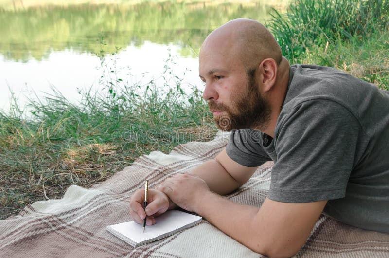 Man Writing in His Notebook in Forest. Stock Photo - Image of work ...