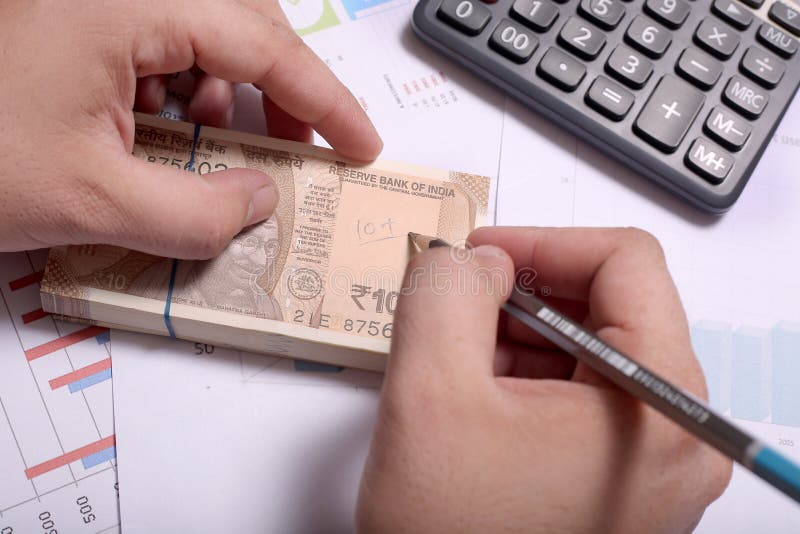 Man is Writing on Indian 10 Rupee Currency Notes with Pencil Stock ...