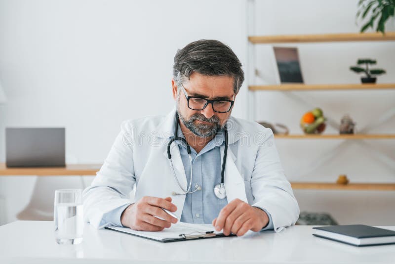 Man Writing Information into the Document. Professional Medical Worker ...
