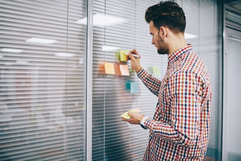 Man Writing Message on Sticky Note Stock Image - Image of note, serious ...