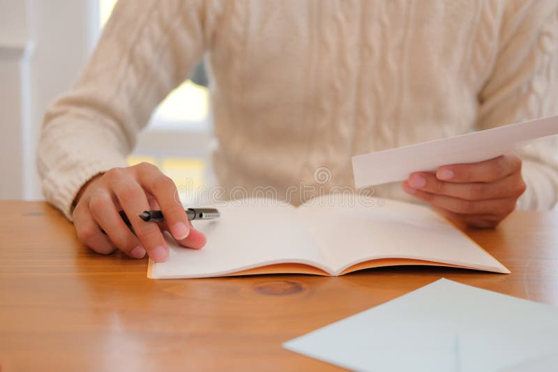 Man Writing Note on Notebook at Home Stock Image - Image of business ...