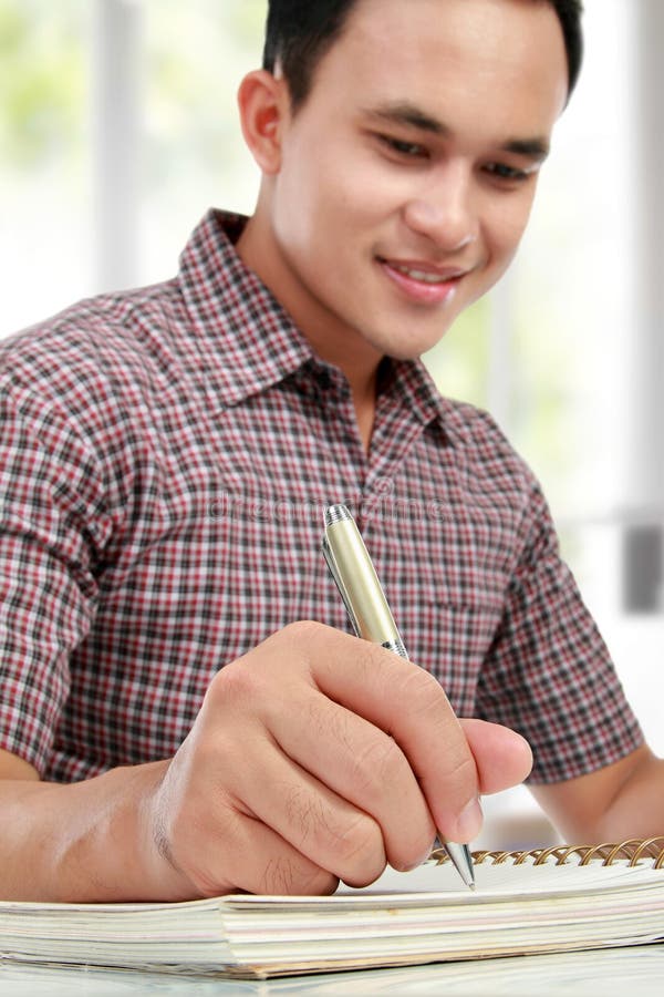 Man writing on notebook stock image. Image of concentrate - 23797809