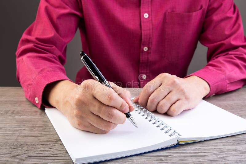 Man writing on notebook stock image. Image of paperwork - 189346015