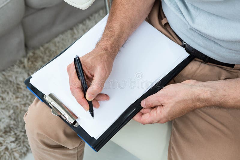 Man writing on notepad stock image. Image of person, notes - 67543909