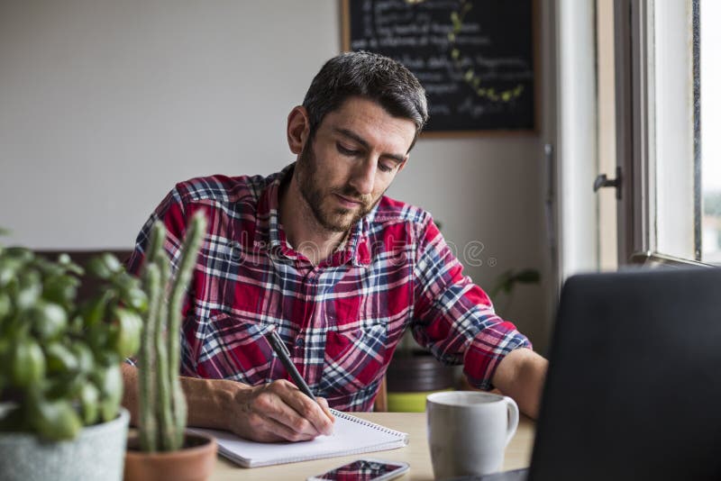 Man writing on notepad stock photo. Image of male, businessman - 225954314
