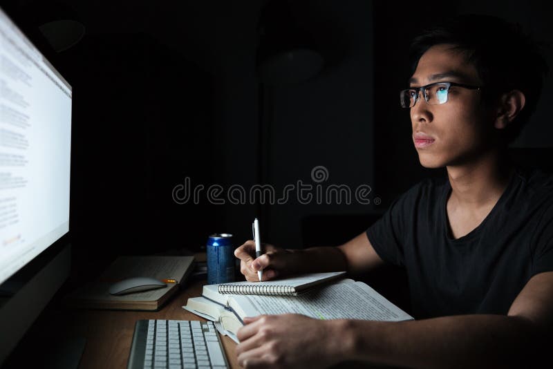 Man Writing in Notepad and Using Computer Stock Image - Image of ...