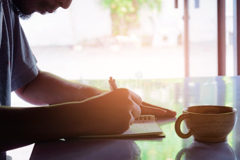 Man Writing Pen in Book on White Table Stock Photo - Image of books ...