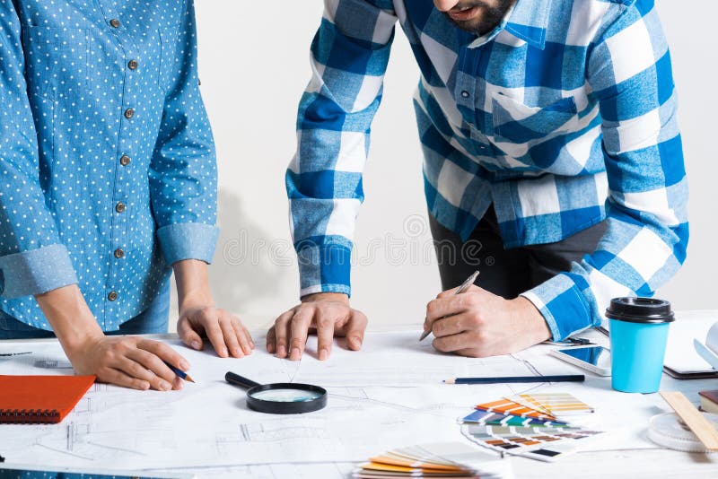 Man Writing with Pen on Technical Drawing Stock Photo - Image of desk ...