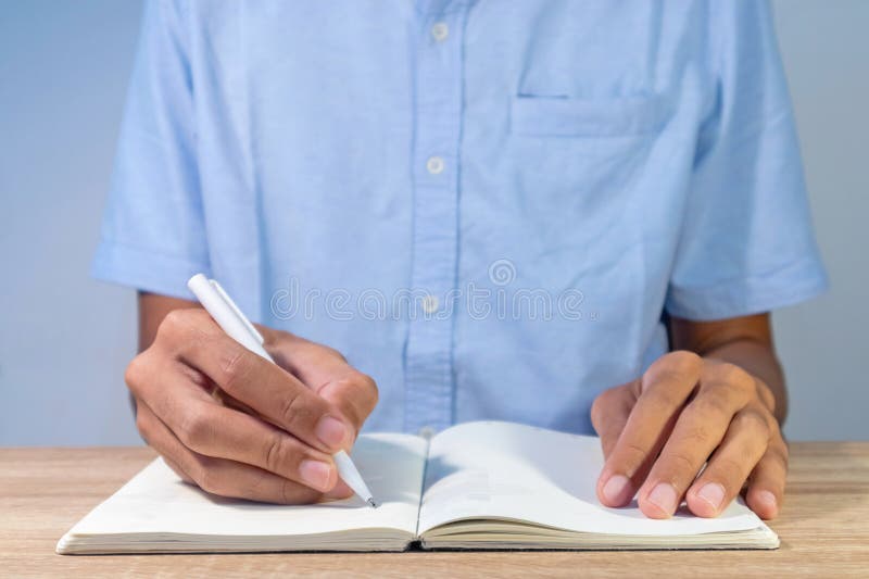 A Man Writing Something at Desk for Notes, Schedule and Planning Stock ...