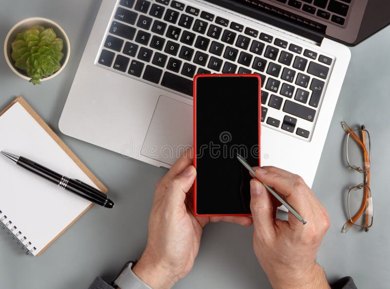 Man Writing Using Cell Phone Onear Laptop Top View Stock Image - Image ...