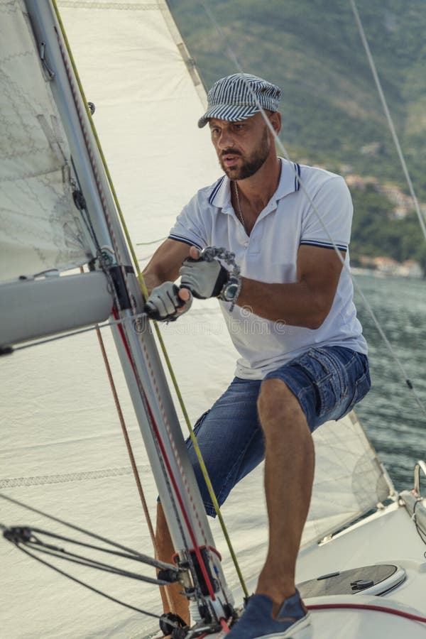 The Man on the Yacht Controls the Sail, Beautiful Seascape Stock Photo ...