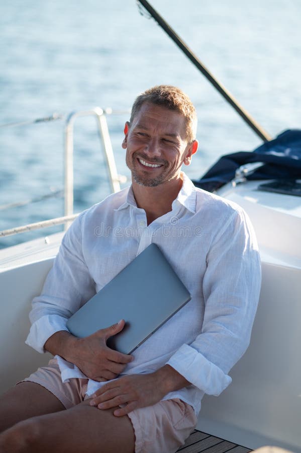 Man on a Yacht Deck with Alaptop in Hands Stock Image - Image of ...