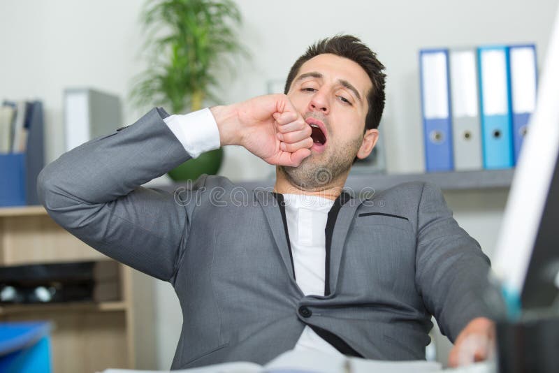 Man Yawning while Sat at Office Desk Stock Photo - Image of exhausted ...
