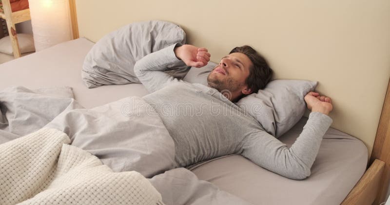 Man Awakening from Sleep in Bed Stock Video - Video of awake, adult ...