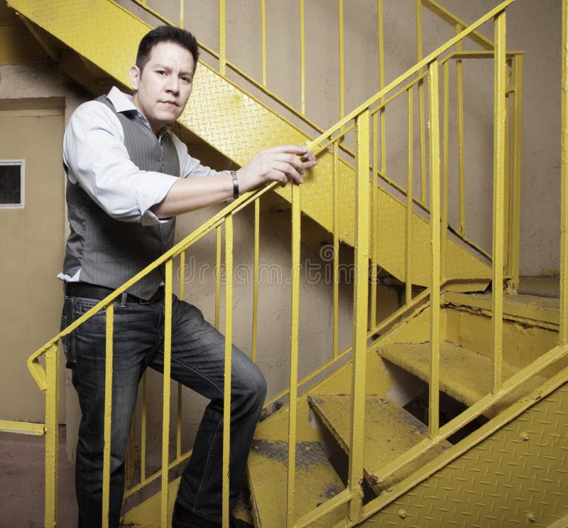 Man on a yellow staircase stock photo. Image of attractive - 13237006