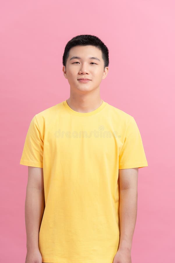 A Man with a Yellow T-shirt Standing Looking at the Camera Stock Image ...