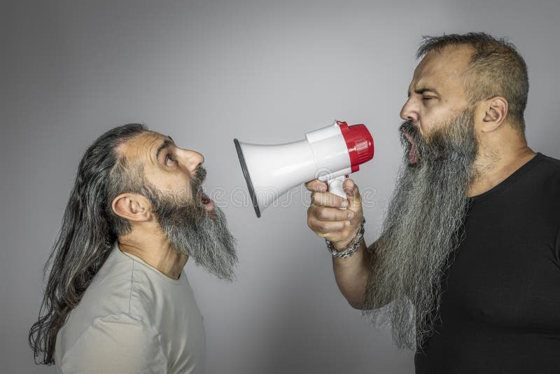 Man Yells with Megaphone To Another Man Stock Image - Image of ...