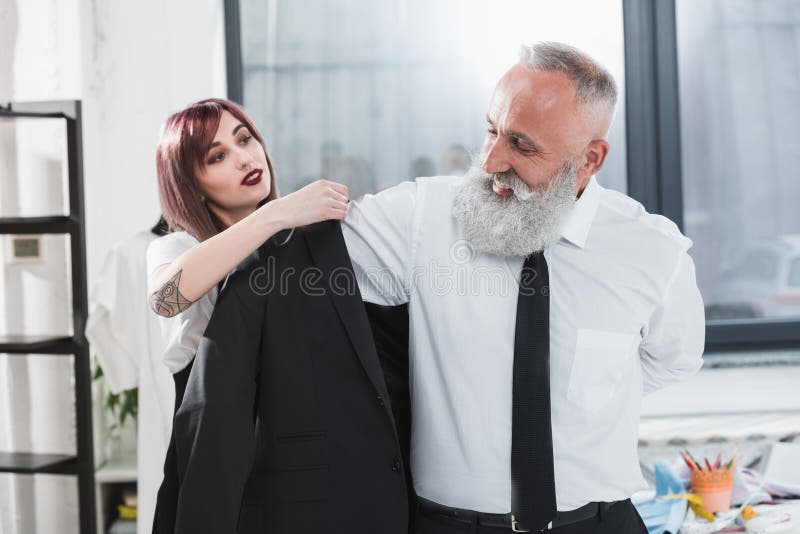 Tailor Fitting Smiling Elderly Man for Suit Jacket Indoors Stock Image ...