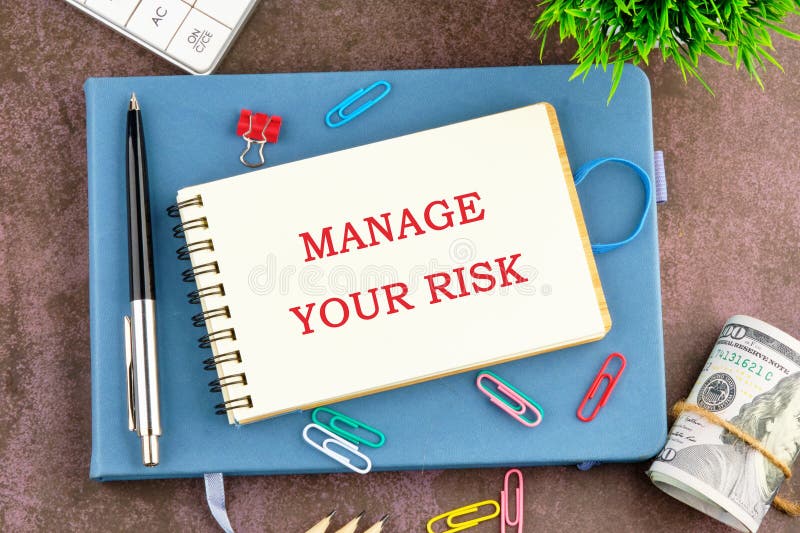 MANAGE YOUR RISK Text Written in the Businessman S Notebook Stock Photo ...