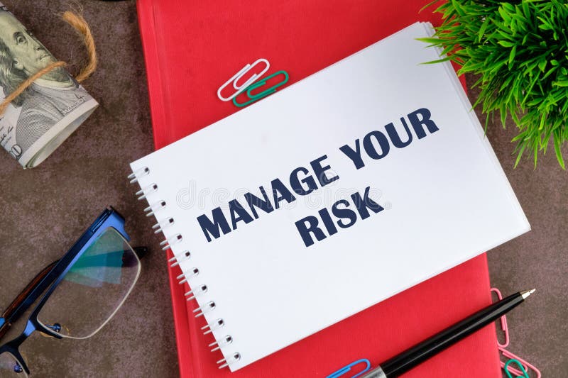 MANAGE YOUR RISK Text Written in the Manager S Address Book Stock Photo ...