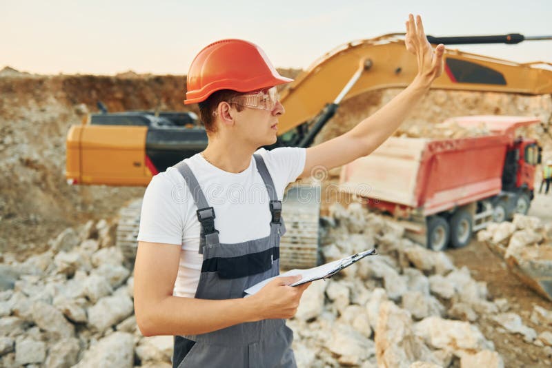 Management of Project. Worker in Professional Uniform is on the Borrow ...