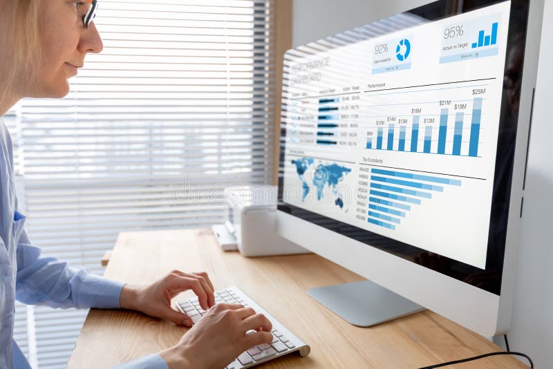 Manager Analysing Performance Data on Dashboard with KPI and Metrics ...