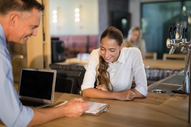 Smiling Manager and Bartender Standing at Bar Counter Stock Image ...