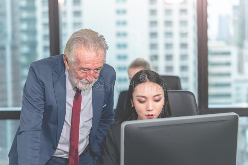 Senior Manager Boss Helping and Teaching His Female Officer in Office ...