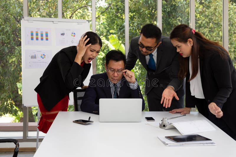 Manager and Business Team Check Information in Laptop Comparing with ...